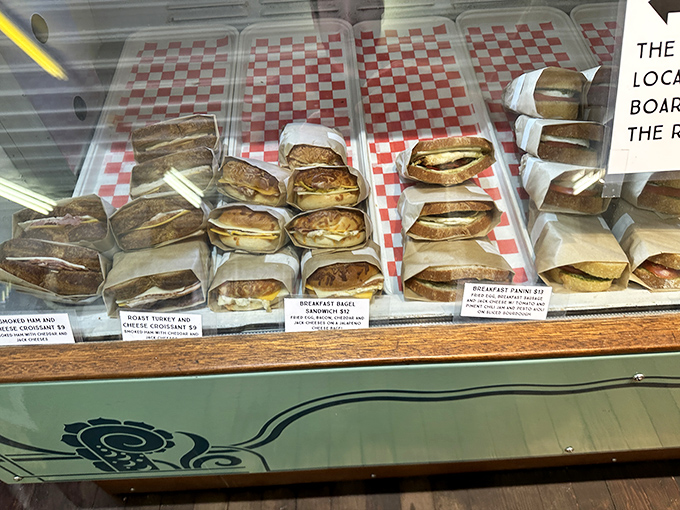 Wrapped in paper, stacked with care—these aren't just sandwiches, they're edible architecture waiting to transform your roadtrip into a culinary expedition.