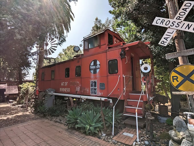 All aboard the whimsy express! This vintage Santa Fe caboose isn't lost—it found its forever home among the castle's eclectic collection.