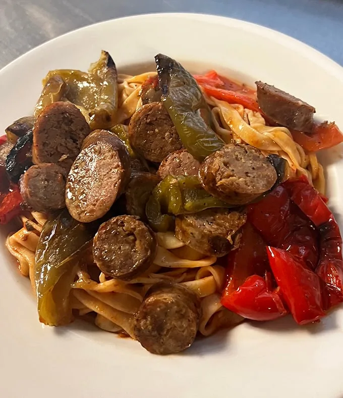Italian sausage and peppers playing hide-and-seek with pasta. The sausage never hides for long—it's too proud of its flavor.