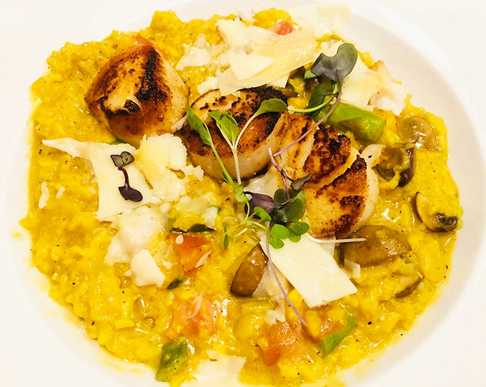 Perfectly seared scallops crown a golden risotto throne – this dish alone is worth the drive to Akron, even if your GPS protests.