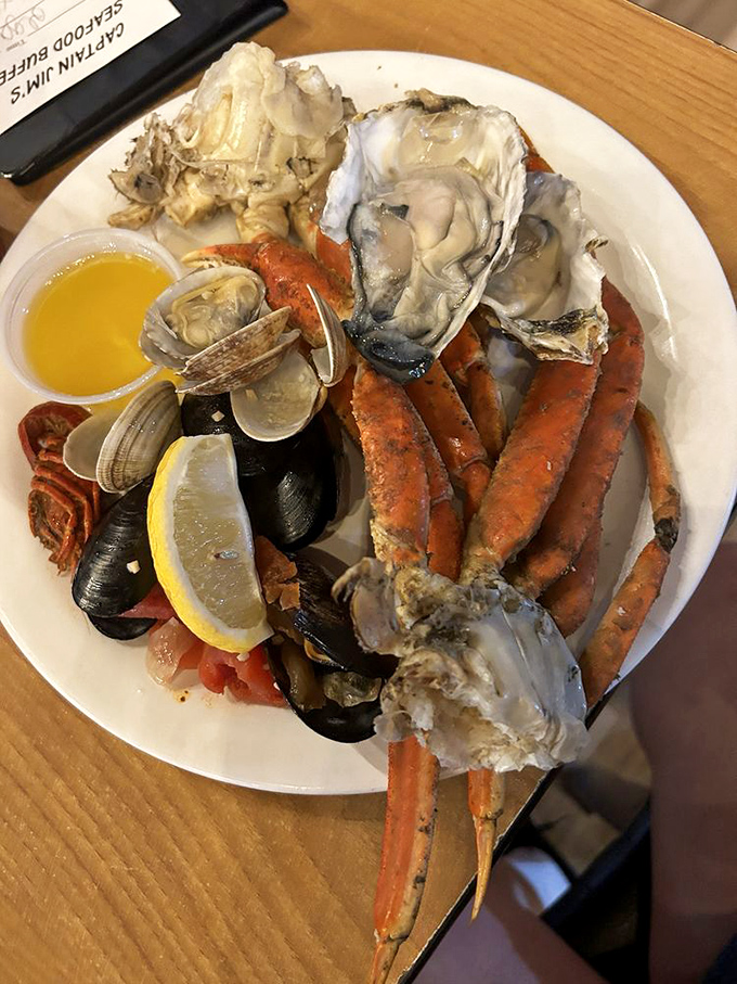 Ocean's bounty on a single plate. Those crab legs and oysters aren't just seafood—they're edible evidence that mountains and oceans can coexist deliciously.