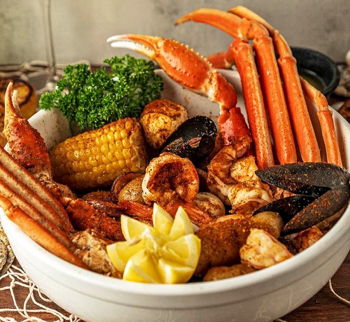 This seafood boil isn't just a meal—it's an event. Snow crab legs, shrimp, mussels, and corn create a symphony of flavors that demands to be shared.
