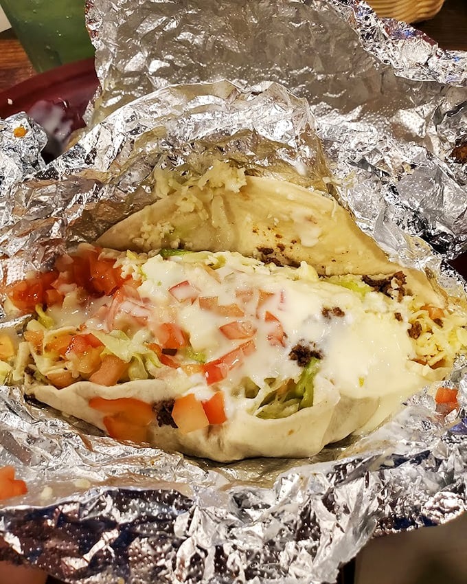 Foil-wrapped perfection—this seafood burrito isn't just a meal, it's an event. The melted cheese blankets fresh ingredients like a comforting hug for your taste buds.