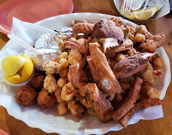 Behold the mountain of fried magnificence! This seafood platter doesn't just feed you—it tells stories of the Atlantic in crispy, golden chapters.