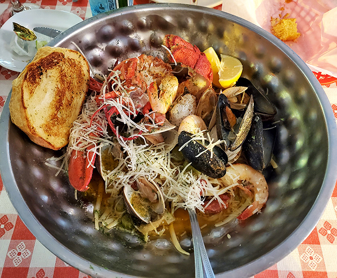 A seafood symphony in a metal bowl—where lobster plays first chair and the supporting shellfish create harmonies that would make Mozart jealous.