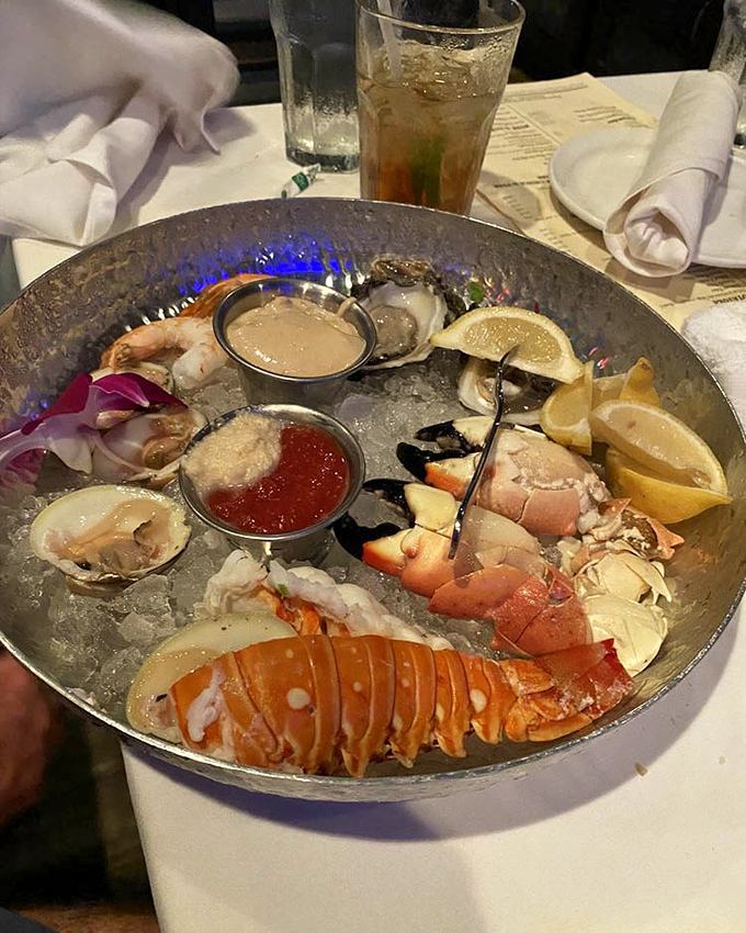 Seafood royalty on ice! This platter showcases Florida's finest treasures with lobster tail, stone crab claws, and oysters – Neptune's jewelry box opened for your pleasure.