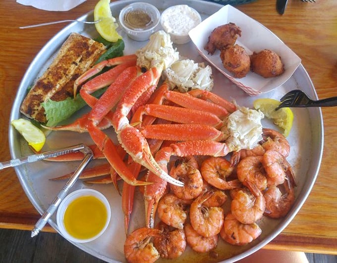 The seafood platter that makes you question why you ever eat anything else. Crab legs, shrimp, and hush puppies—the holy trinity of coastal cuisine.