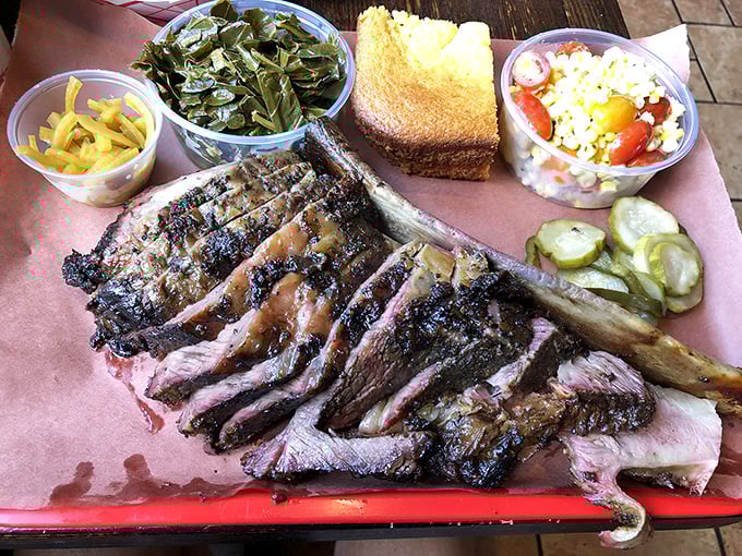 Behold the star of the show: a short rib that would make Fred Flintstone weep with joy, served with sides that refuse to be upstaged.