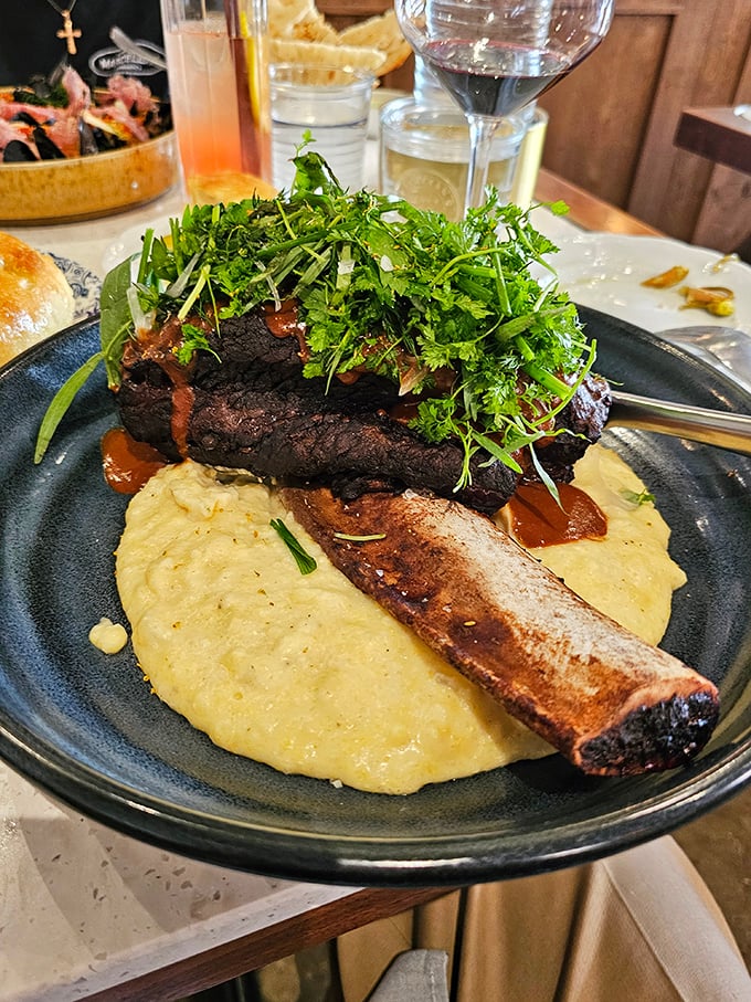This short rib isn't just falling off the bone—it's practically filing for independence. Nestled on creamy polenta with fresh herbs, it's comfort food with a PhD.