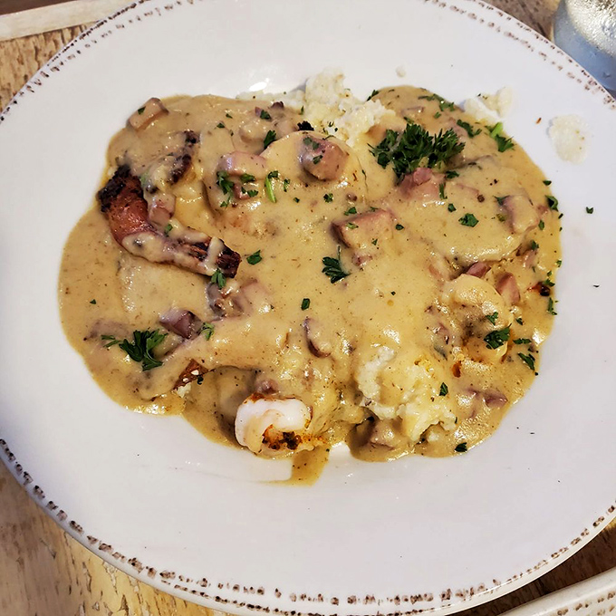 Shrimp and grits that would make a Southerner weep with joy—creamy, decadent, and worth crossing state lines for.