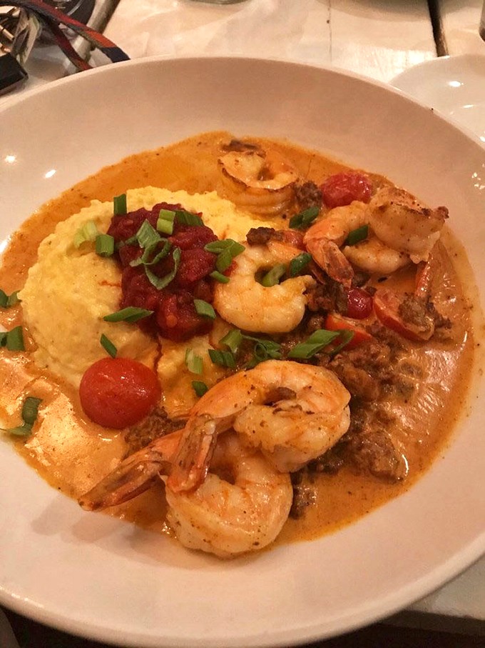 Shrimp and grits that would make a Southerner weep with joy—plump crustaceans swimming in a sauce worthy of Olympic gold.