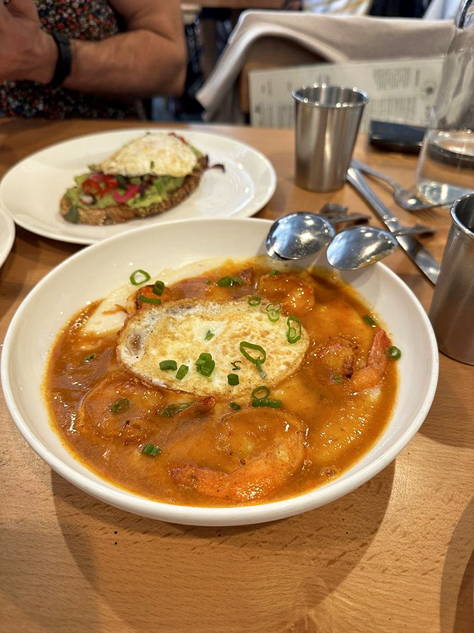 The legendary shrimp and grits—a bowl of Southern comfort with California flair. That sunny-side egg is the crown jewel.