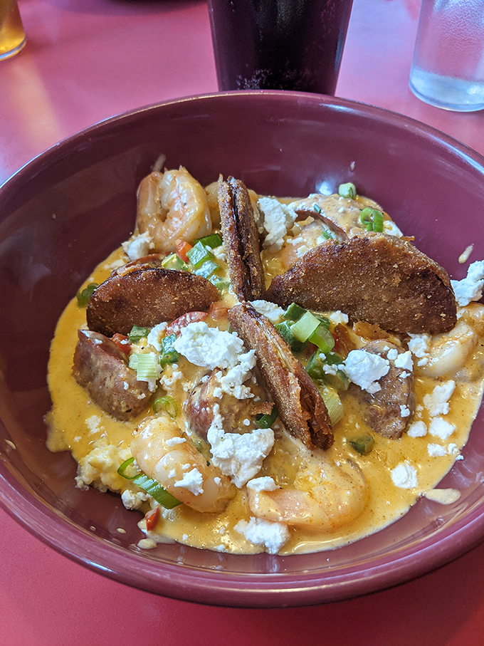 Shrimp and grits that would make a Lowcountry chef weep with joy – creamy, cheesy comfort crowned with plump shrimp and crispy andouille.