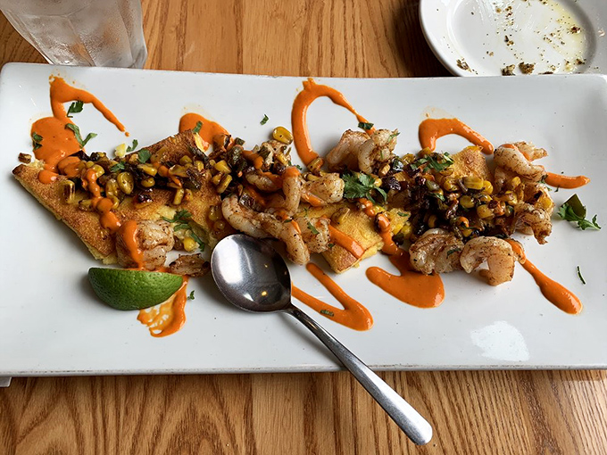 This isn't just shrimp—it's a flavor carnival with vibrant sauces dancing across the plate. Your fork doesn't stand a chance.