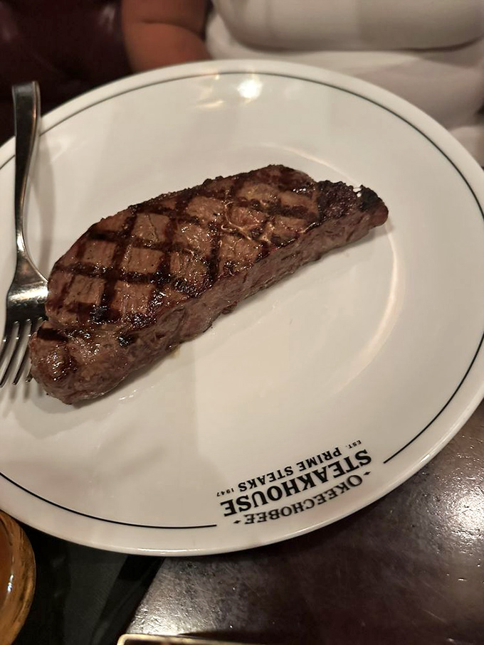 This sirloin arrives with perfect grill marks that would make a geometry teacher weep with joy.