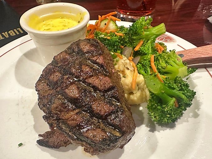 Behold the sirloin in its natural habitat—perfectly charred exterior, pink interior, and accompanied by its lifelong companions: mashed potatoes and broccoli.