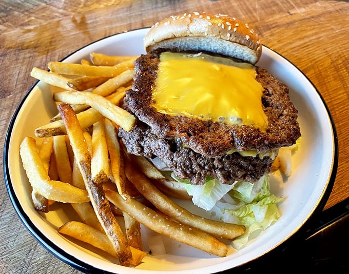 The star of the show: a perfectly smashed burger with crispy edges and melty American cheese. Poetry on a plate, philosophy in a bun.