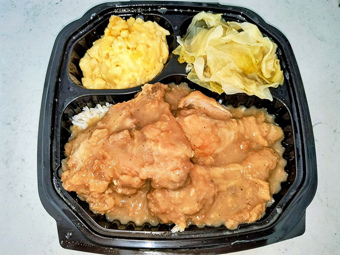 Smothered chicken that doesn't just speak to your soul—it sings a full gospel choir. Swimming in gravy that could make a vegetarian reconsider.