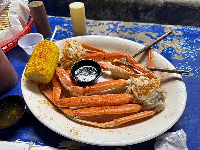Snow crab legs splayed across the plate like nature's puzzle—a delicious challenge that rewards patience with sweet, tender meat.