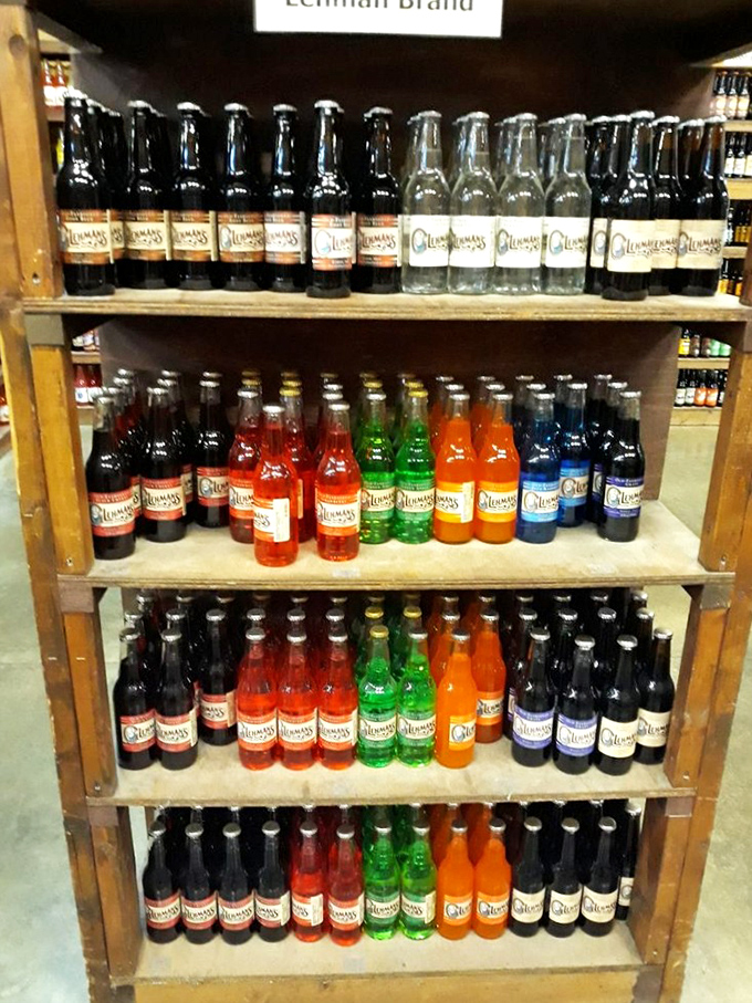 A rainbow of old-fashioned sodas lines the shelves, each bottle a fizzy time machine to childhood summer afternoons.
