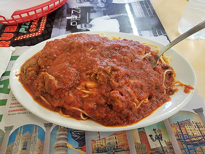 This isn't just spaghetti with meat sauce—it's a lava flow of homestyle gravy cascading over pasta, demanding respect and possibly a bib.
