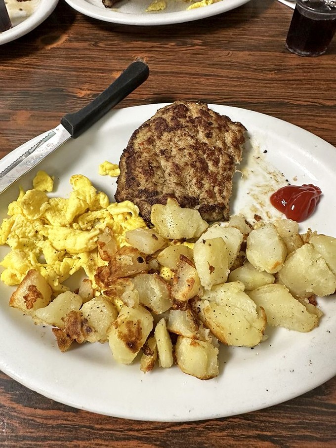 Breakfast perfection doesn't need fancy plating – just perfectly cooked eggs, crispy hash browns, and sausage that means business.