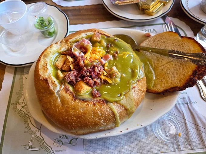 Split pea soup served in a bread bowl: where comfort food meets edible dishware. The vibrant green hue might raise eyebrows, but the flavor will raise spirits.