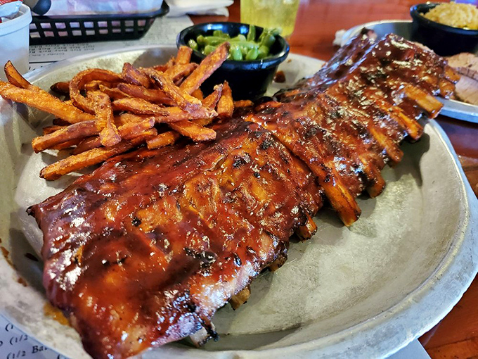 These St. Louis ribs don't just fall off the bone—they practically leap into your mouth. The glistening sauce creates a beautiful lacquer that should be hanging in a museum.