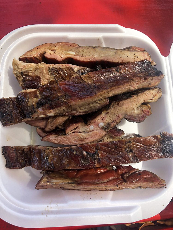 These St. Louis ribs aren't just cooked—they're transformed. That smoke ring isn't just pink; it's a barbecue love letter written in smoke and time.