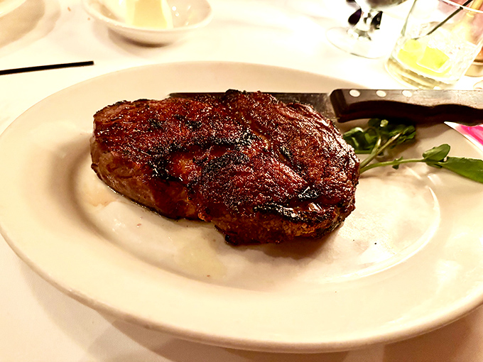 Behold the star of the show – a perfectly seared steak with that magical crust that makes time stand still and conversation pause.