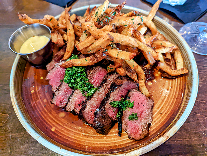 Perfectly pink steak, herb-flecked truffle fries, and a sauce that should be illegal in seven states. This plate doesn't need a filter—it needs a moment of silence.