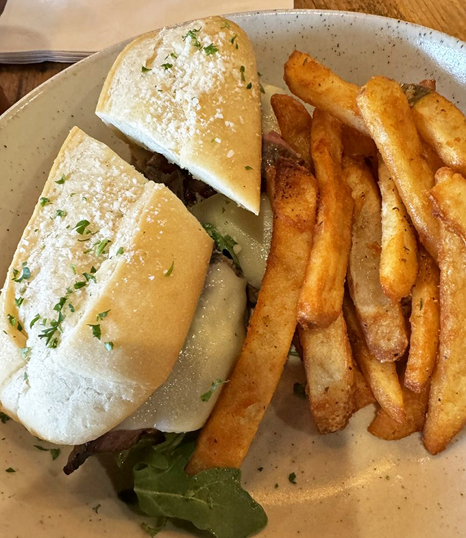 This sandwich doesn't just satisfy hunger—it creates food memories. Golden fries and that perfectly toasted bun are the supporting actors to the star protein.