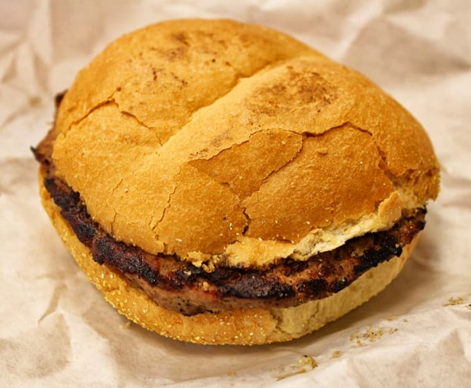 Behold the steak sandwich that launched a thousand satisfied sighs – charcoal-kissed perfection on a bun.