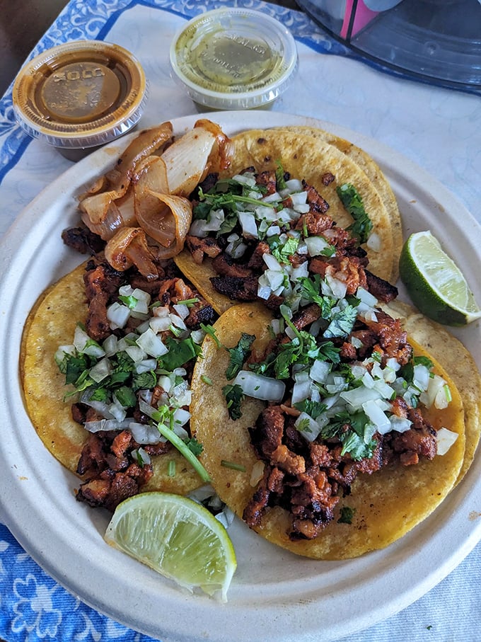 These street tacos aren't playing around – perfectly seasoned meat, fresh cilantro, and onions with lime wedges standing by. Taco Tuesday just got serious competition.