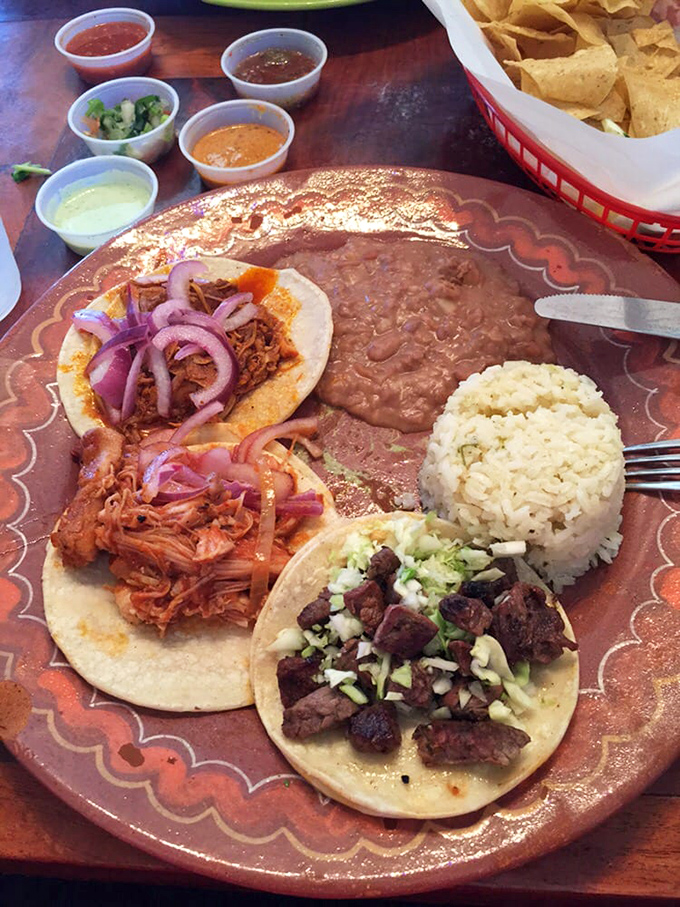 Taco perfection doesn't happen by accident. Three distinct varieties, rice, beans, and a rainbow of salsas create a plate that's basically edible artwork.