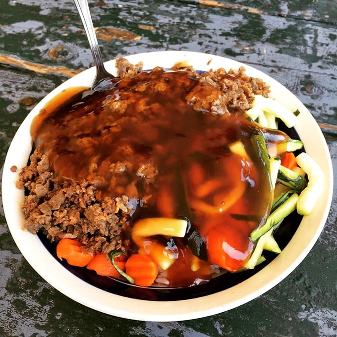 The legendary teriyaki beef bowl in all its glory—tender meat swimming in that addictive sauce with fresh vegetables playing supporting roles. Worth every minute in line