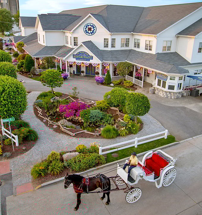 Flower baskets and white picket fences aren't just for show. The Blue Gate Restaurant's exterior promises what awaits inside: comfort, charm, and calories worth every bite.