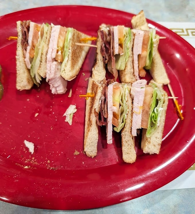 Behold the architectural marvel that is the Turkey Club—a sandwich so perfectly constructed it could qualify for an engineering award.