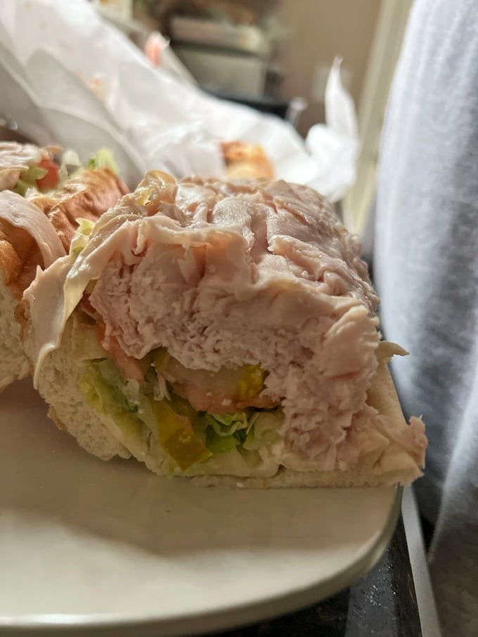 Turkey piled higher than your weekend to-do list. This hoagie doesn't just satisfy hunger – it abolishes it with cold-cut authority.