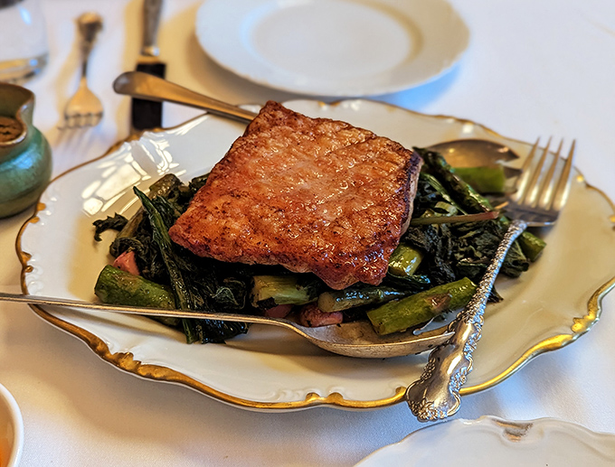 The legendary venison scrapple – crispy exterior giving way to a rich, savory interior atop seasonal greens. Worth every mile of the journey.