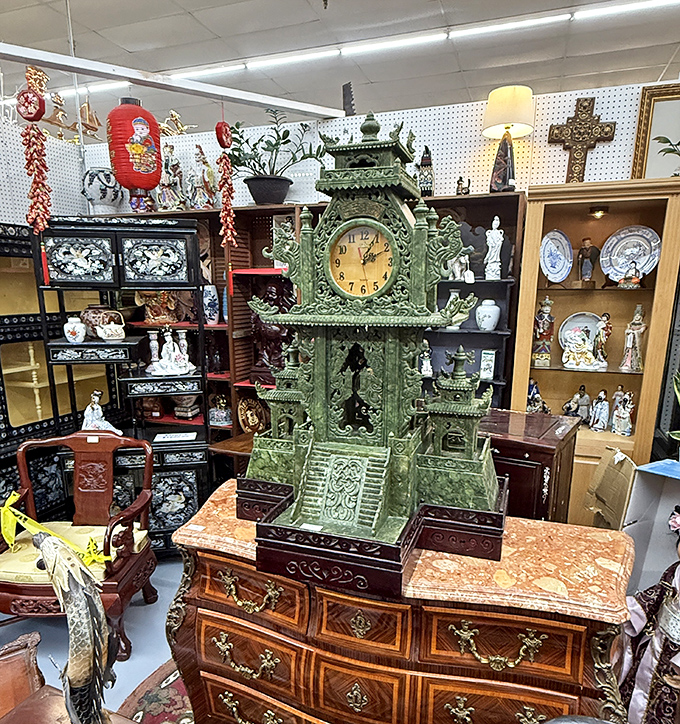 This ornate jade-colored clock isn't just telling time—it's a conversation piece that would make even the Addams Family jealous.