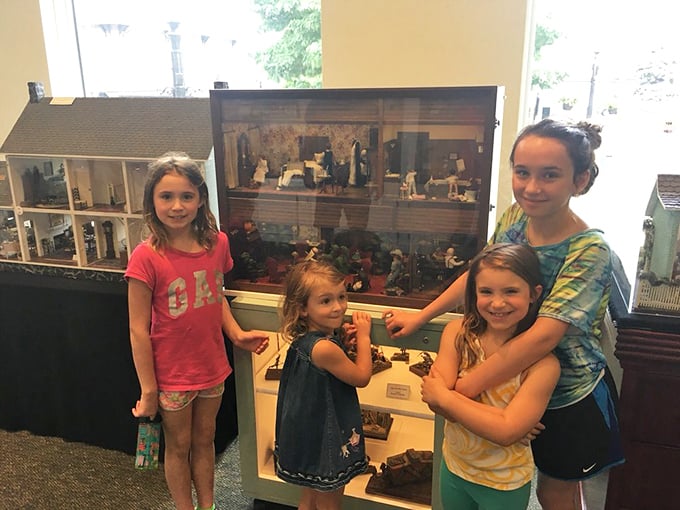 Young visitors discover the universal truth that no matter your age, there's something mesmerizing about peering into perfectly crafted miniature worlds. 