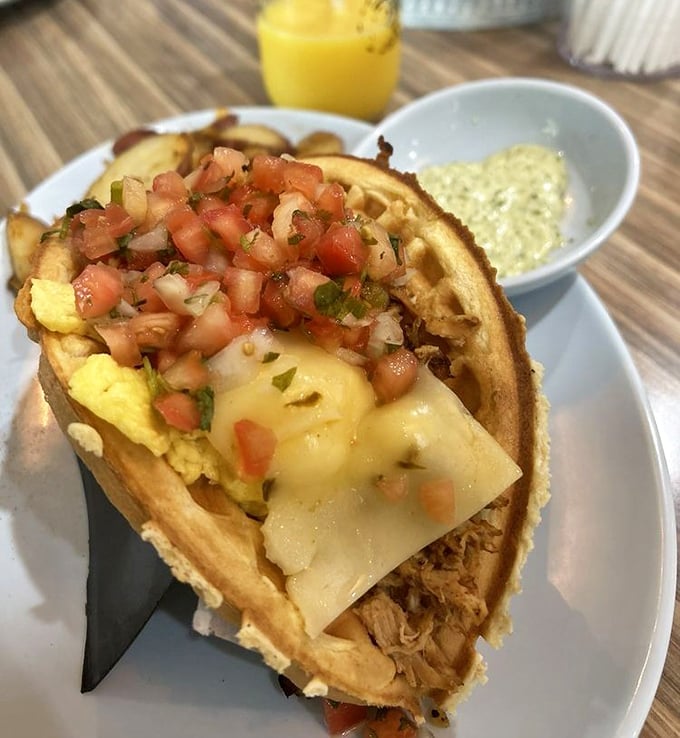 The legendary waffle taco in its natural habitat—crispy yet pliable, loaded with pulled pork, eggs, cheese, and pico de gallo. Breakfast engineering at its finest.