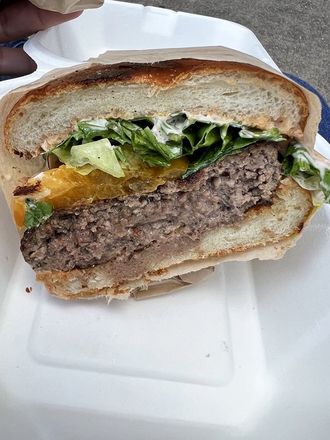 This isn't just a burger; it's a masterclass in beef architecture—juicy, perfectly seasoned, and nestled between bread that knows its supporting role.