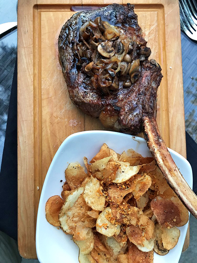 This bone-in masterpiece topped with caramelized mushrooms isn't just dinner—it's a primal experience that would make Fred Flintstone weep with joy.