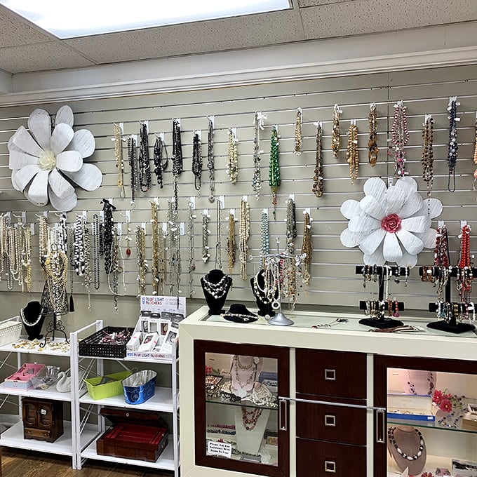Jewelry displays sparkle with possibility—costume pieces that could pass for heirlooms and necklaces waiting for their second chance to make a statement.