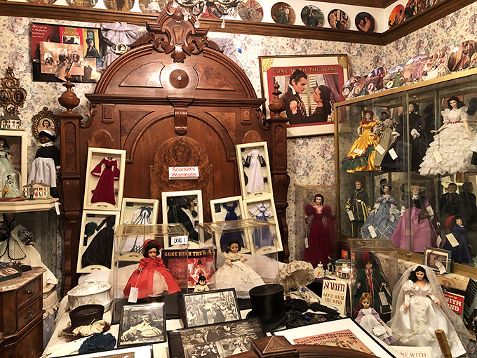 Victorian elegance in miniature—this elaborate display combines antique dolls with period furnishings that would make Downton Abbey's set designers jealous.