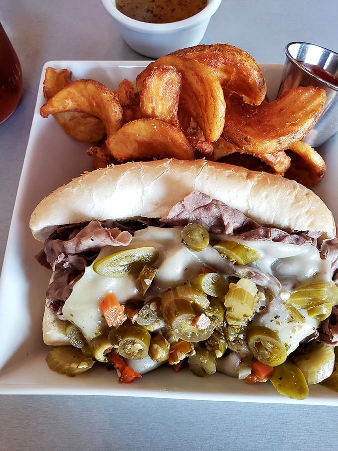 This isn't just a sandwich; it's architecture with pickles. The potato wedges aren't sides—they're co-stars in this delicious production.