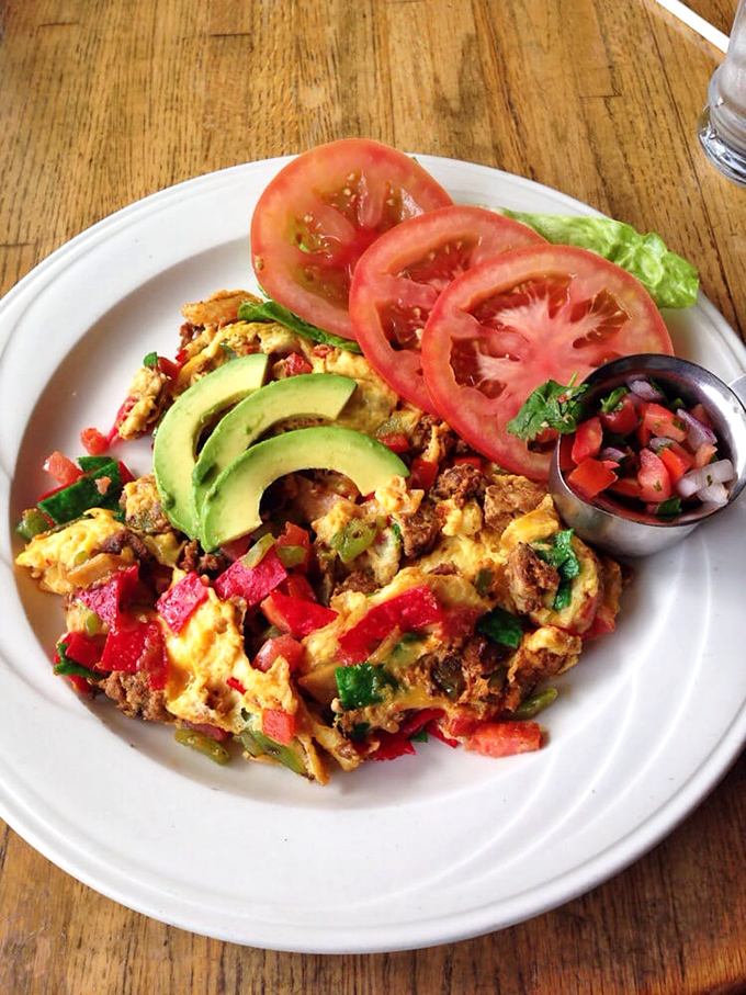 This isn't just a scramble—it's a colorful fiesta on a plate. Fresh avocado, pico de gallo, and eggs harmonizing like a perfectly calibrated breakfast symphony.