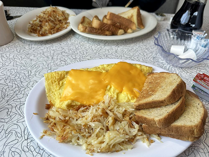 Breakfast perfection doesn't need fancy plating—just golden hash browns, toast that's actually toasted, and eggs that remind you why the chicken came first.